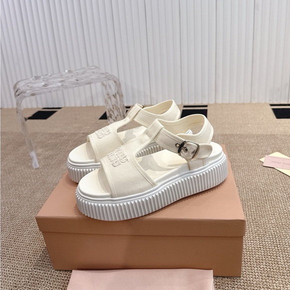 Miu Miu | Shoes | Miu Miu White Quilted Leather Slides With Logo Detail ...